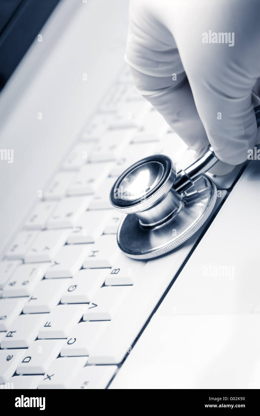 Repair of computer by a surgeon medic Stock Photo - Alamy