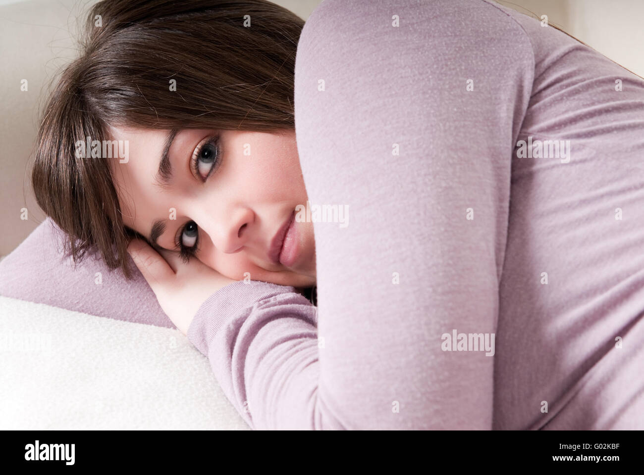 Young woman portrait relax lying on couch Stock Photo - Alamy