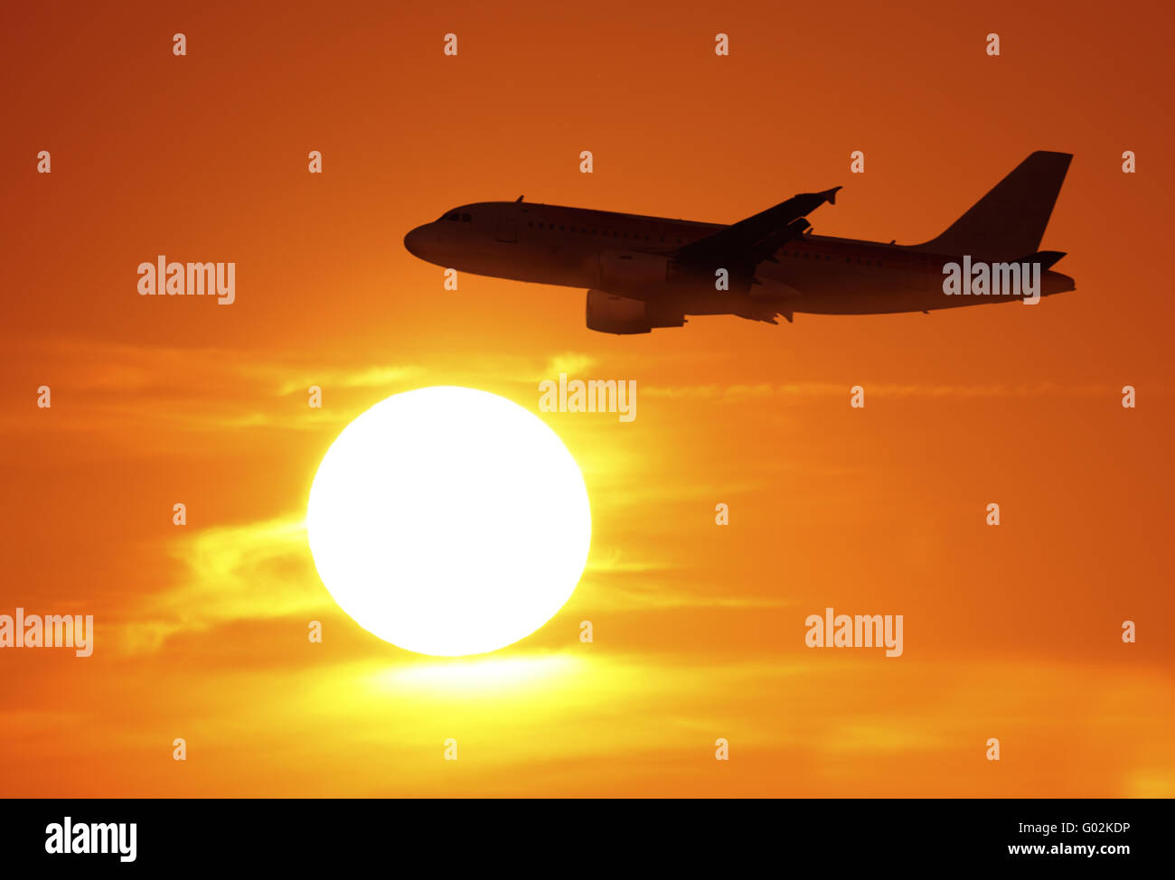 Flying in orange sky Stock Photo - Alamy