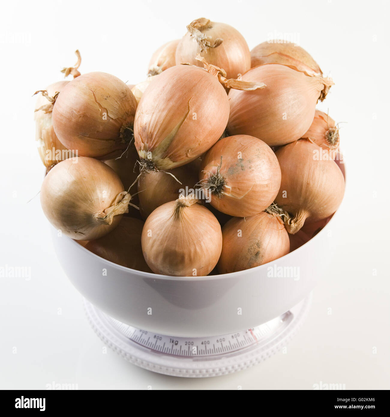 onions in a kitchen scale Stock Photo - Alamy