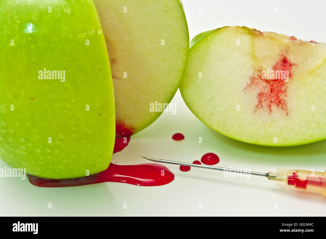 Blood drawn out of green apple bleeding with apple piece Stock Photo ...