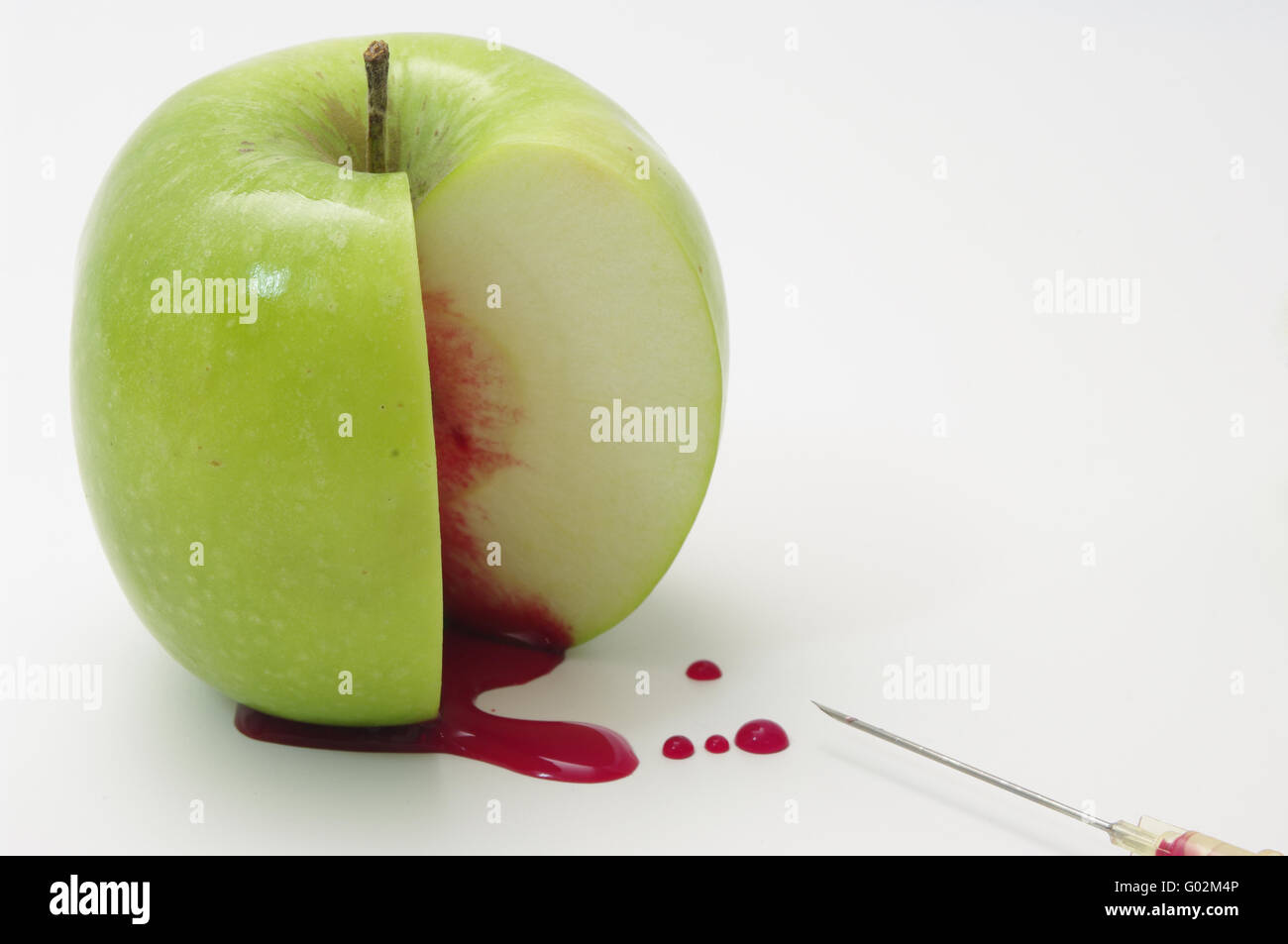 Blood drawn out of green apple bleeding Stock Photo - Alamy