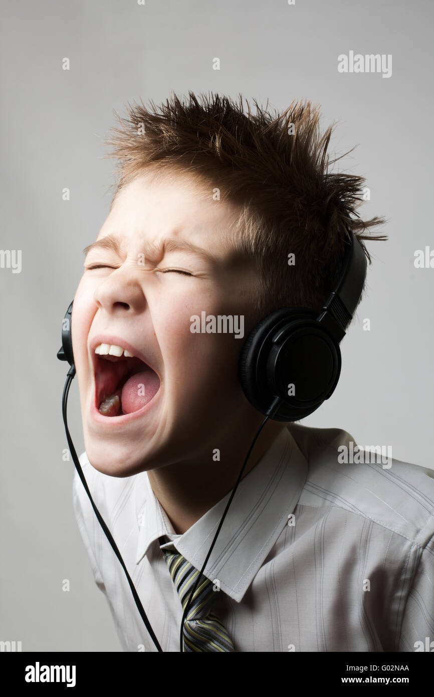 Ten year young child screaming with angry face expression isolated on ...