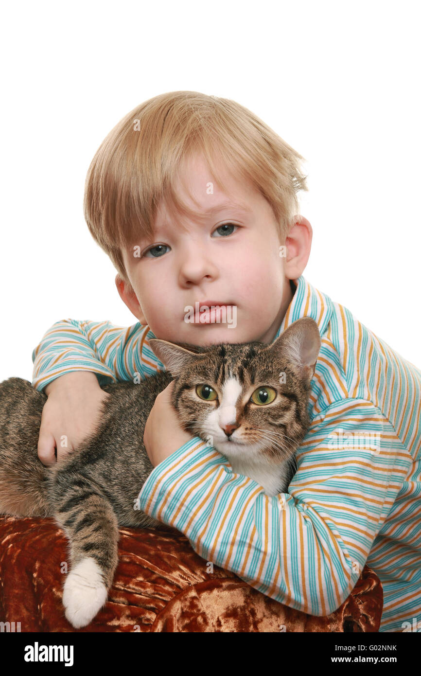 Thoughtful boy with an angry cat. Studio photography Stock Photo - Alamy