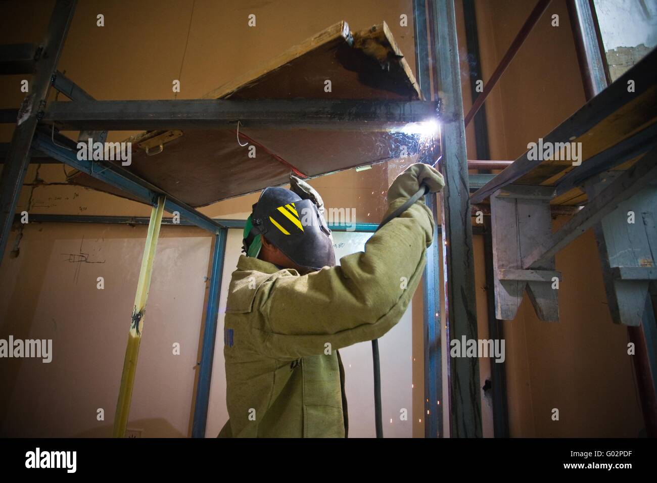 Welder in protective mask welding metal construction on open air Stock ...