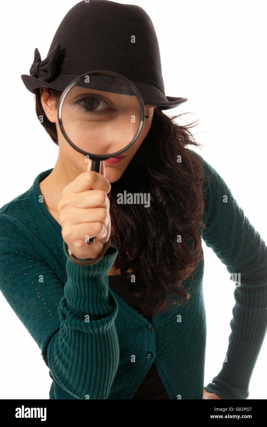 Young woman looking through magnifying glass loupe detective isolated ...