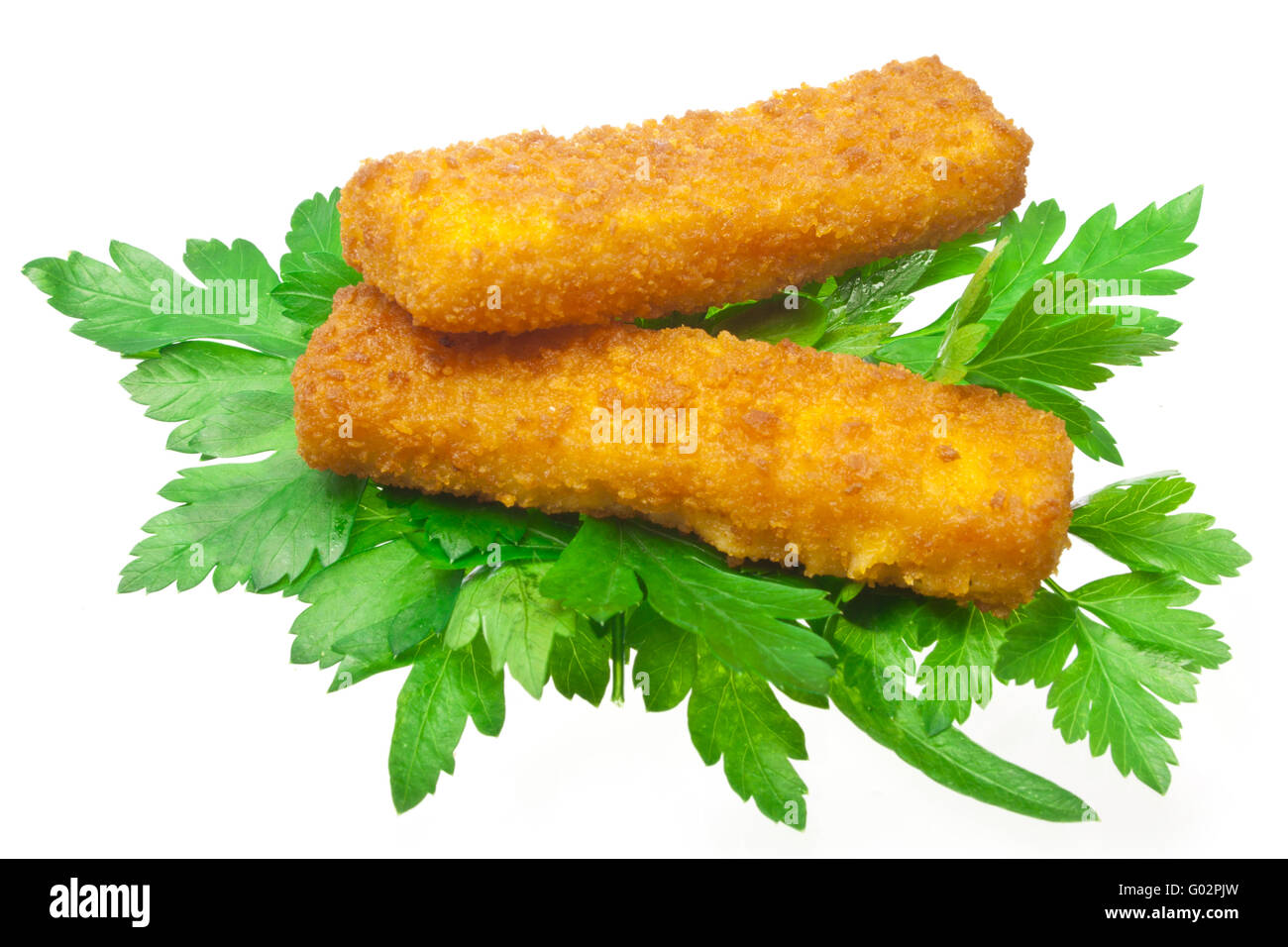 Two fish sticks isolated on white with some parsley Stock Photo - Alamy