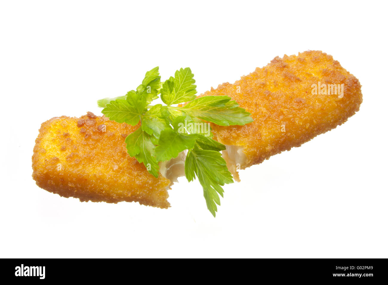 Broken fish stick isolated on white with some parsley Stock Photo - Alamy