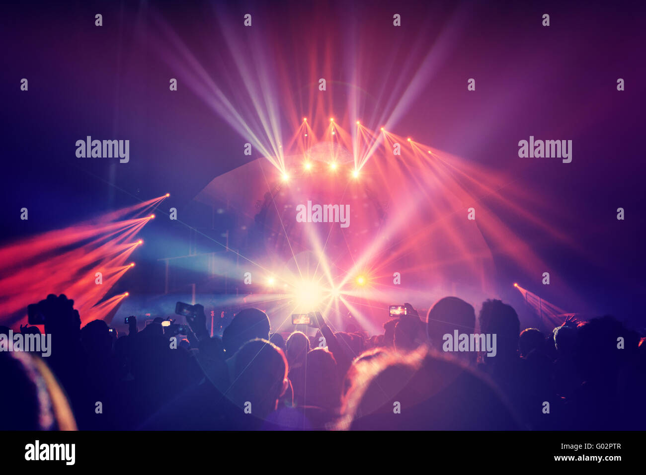 Large group of a happy young people enjoying concert, having fun ...