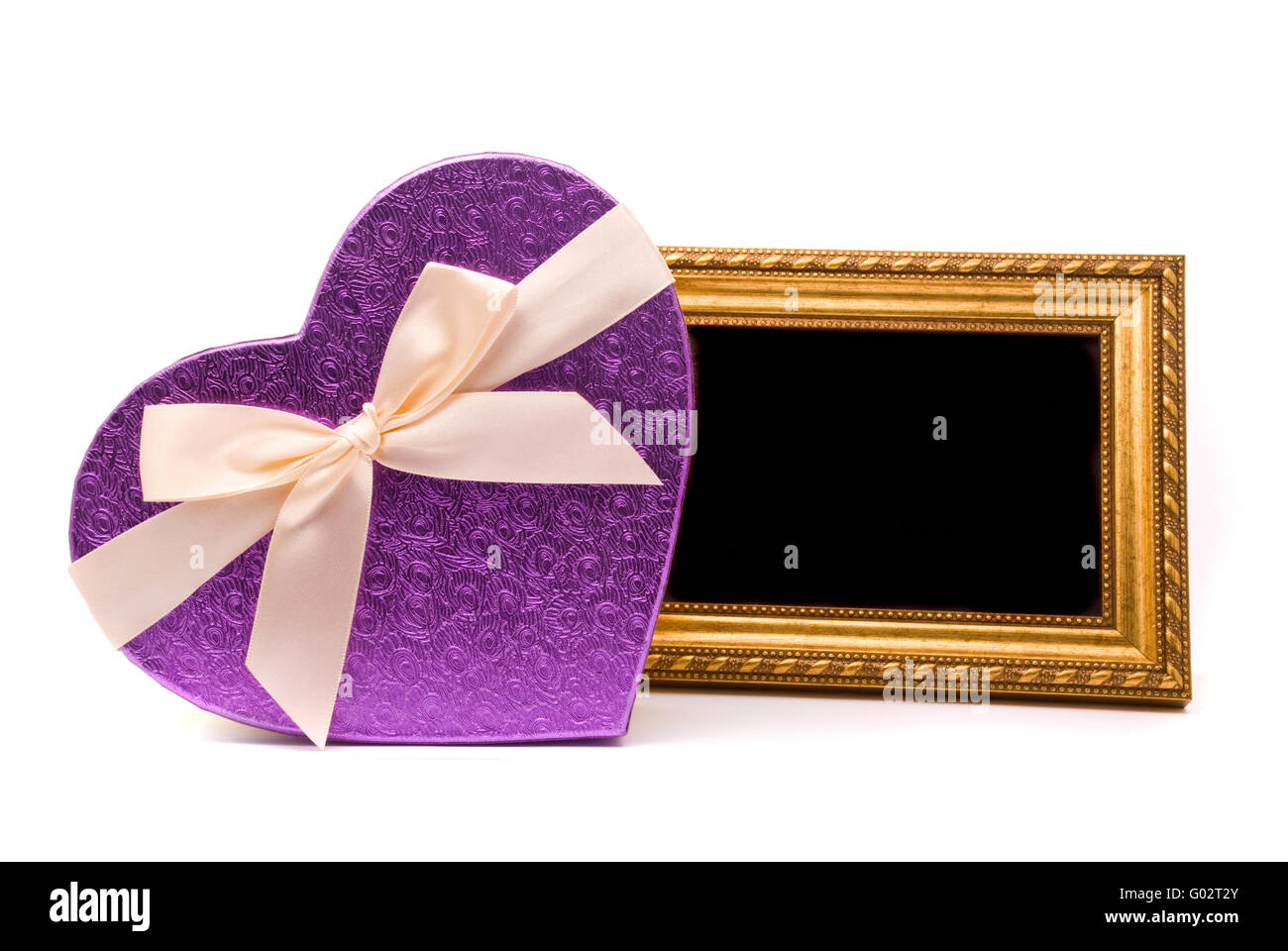 Gold frame and gift box on a white background Stock Photo - Alamy