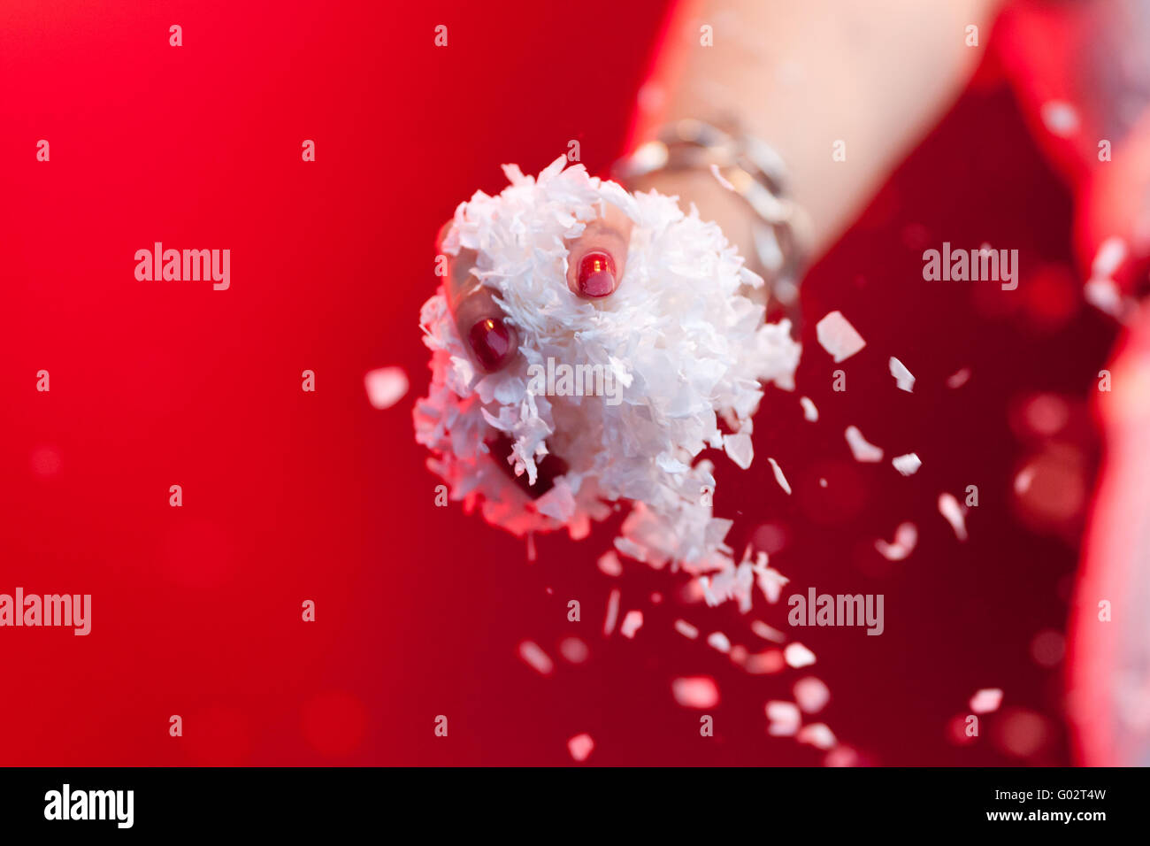 white flakes on red background Stock Photo - Alamy