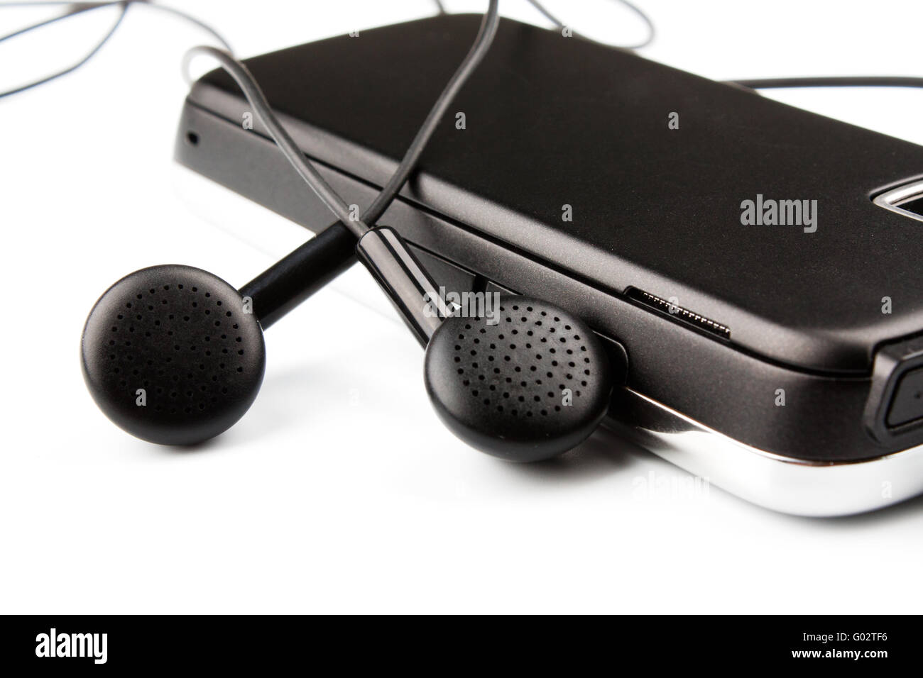 the mobile phone with ear buds isolated on white background Stock Photo ...