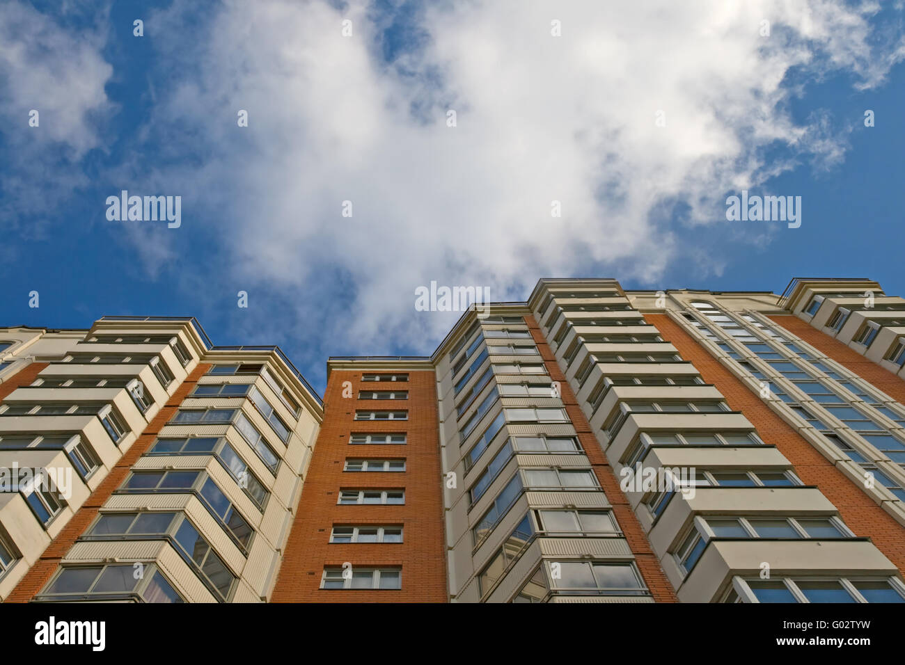 A residential multistory house and sky with clouds Stock Photo - Alamy