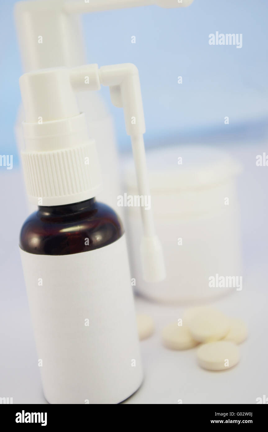 Bottle of Medicine with pills and spray for nose Stock Photo - Alamy