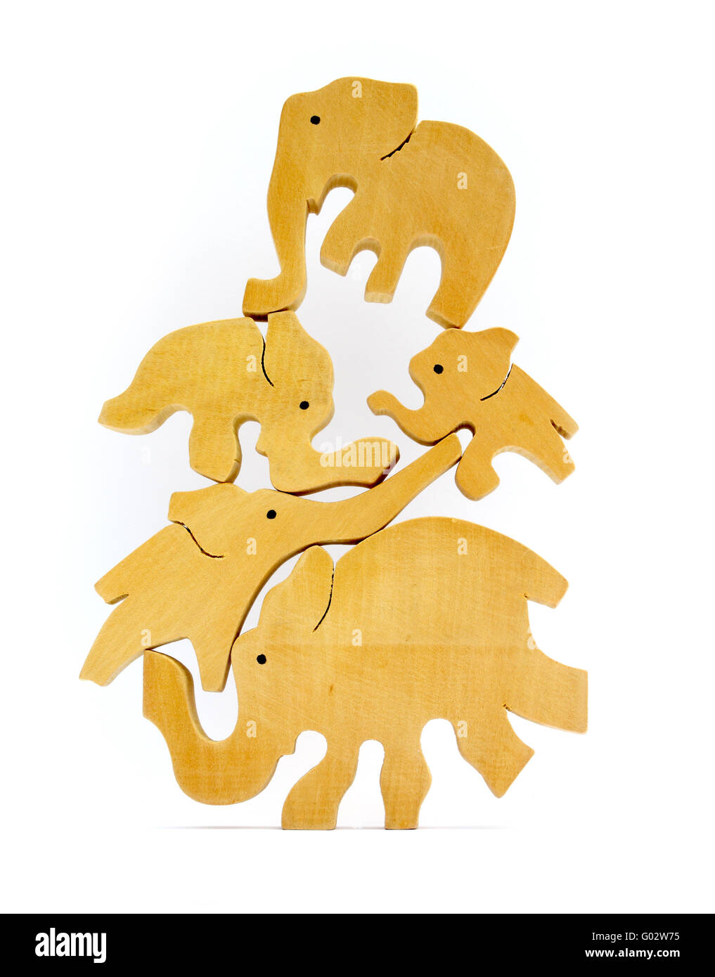 Five traditional nepalese wooden toy elephants balanced on top of each ...