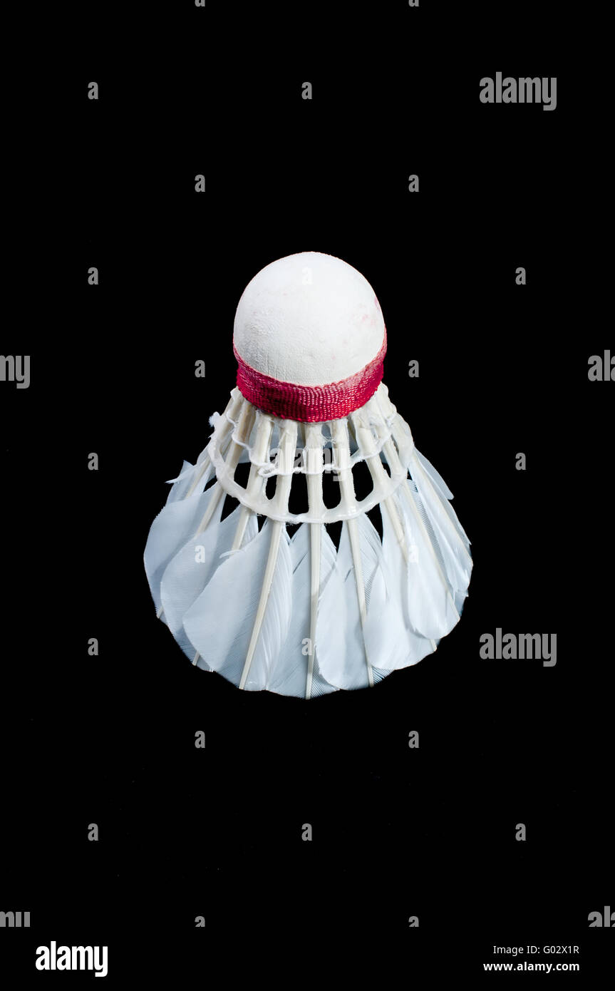 Single white shuttlecock against the black background Stock Photo - Alamy