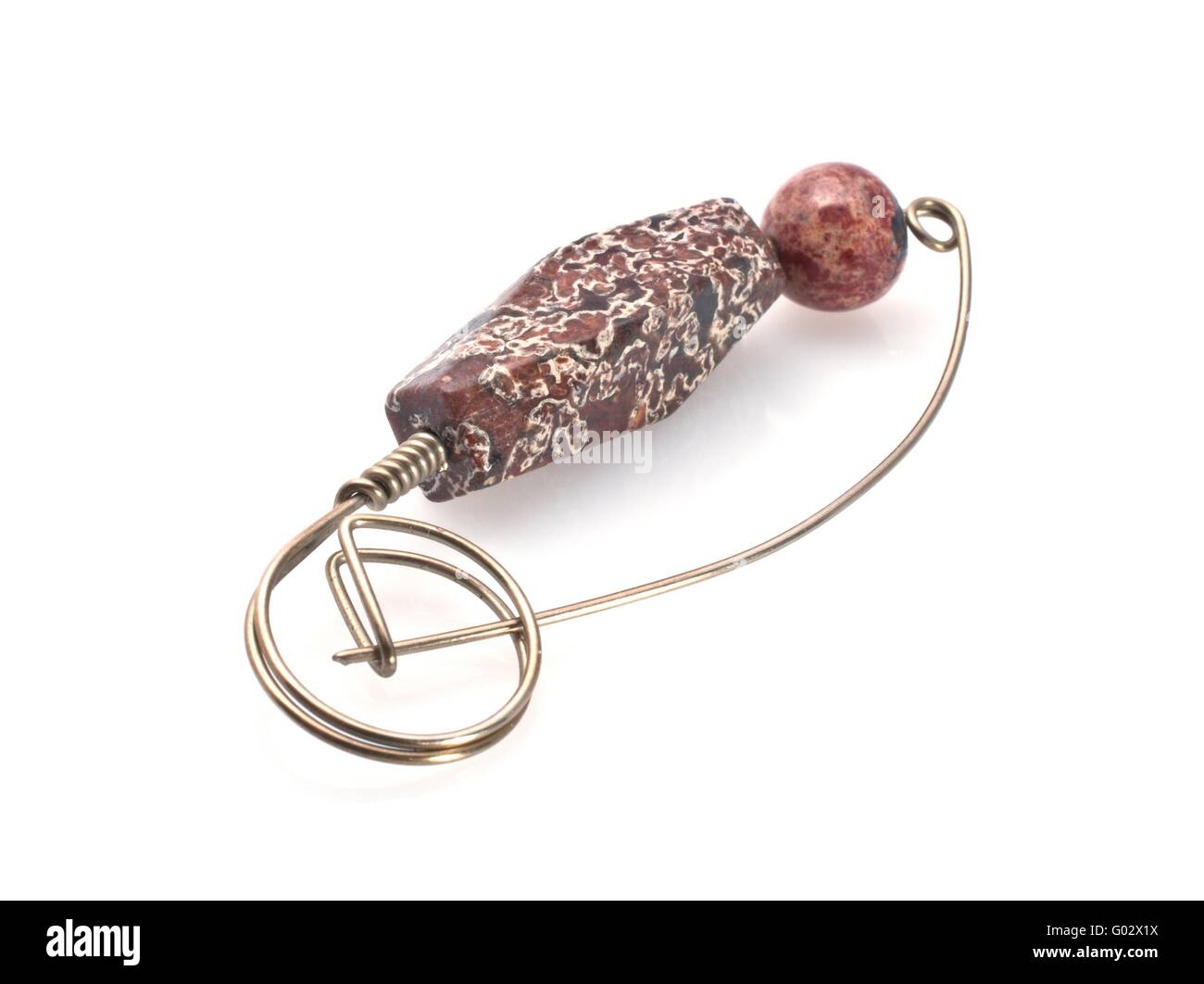 Safety pin with beautiful stones on a white background Stock Photo - Alamy