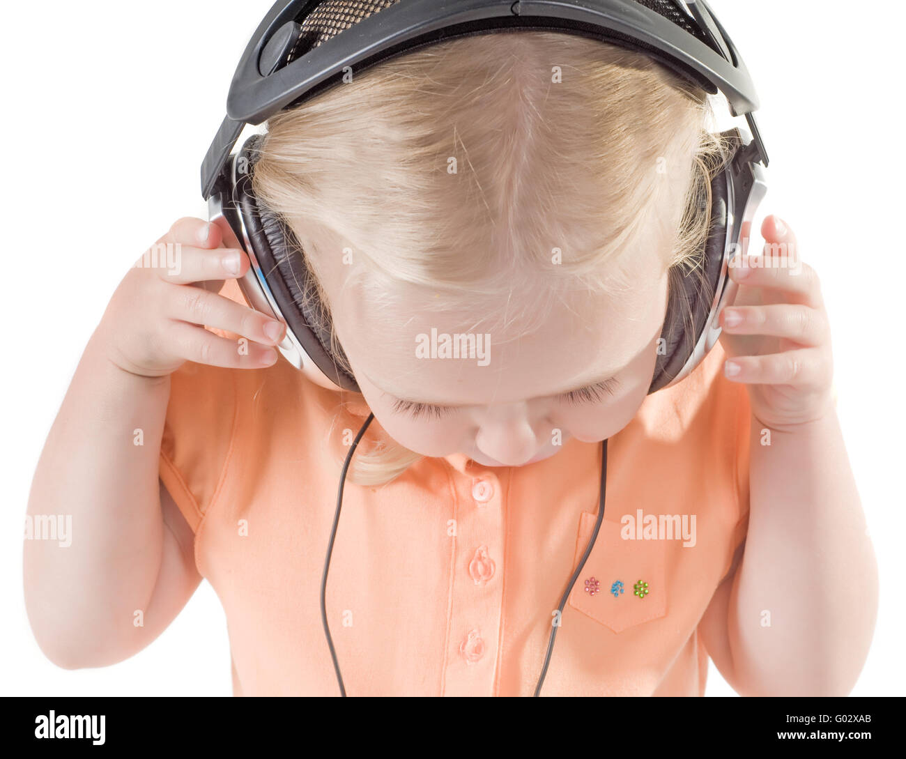Shot of little girl with headphones in studio Stock Photo - Alamy