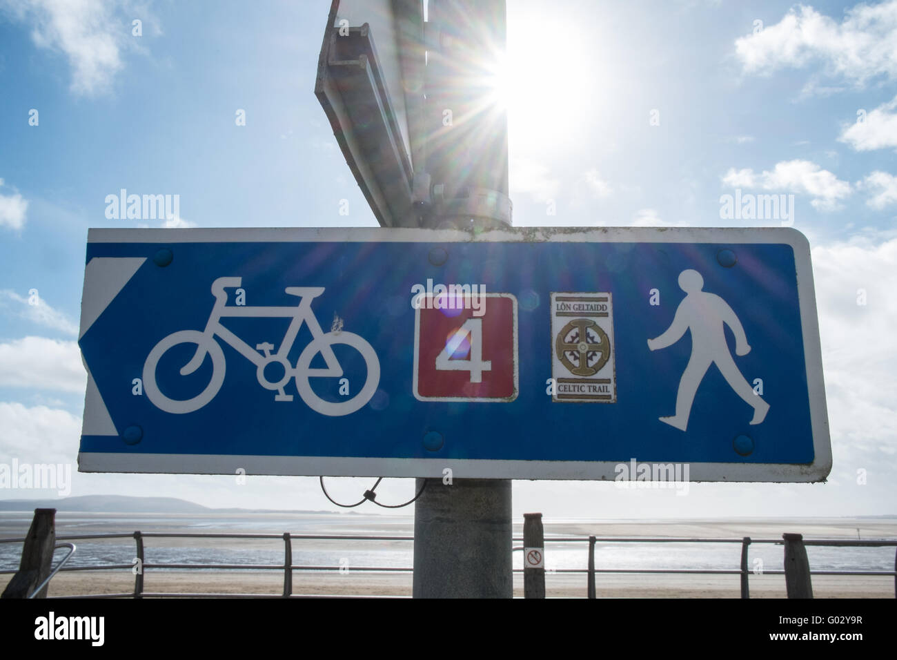 Cycle path route 4 sign and hiking on Millennium Coastal Path at ...