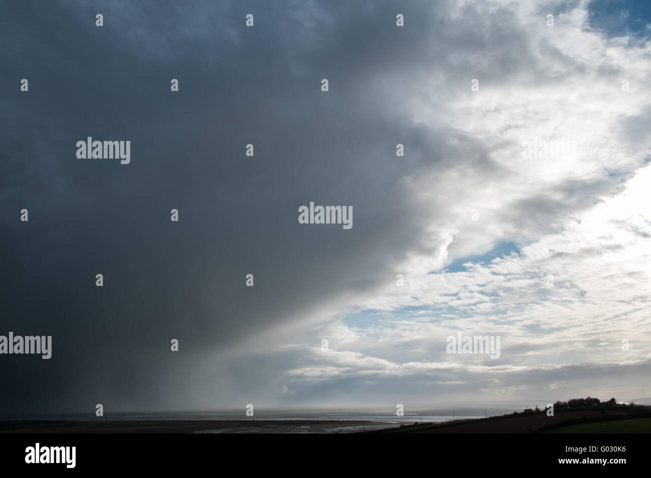 Weather.Storm cloud front over Pembrey viewed from Llansaint hilltop ...