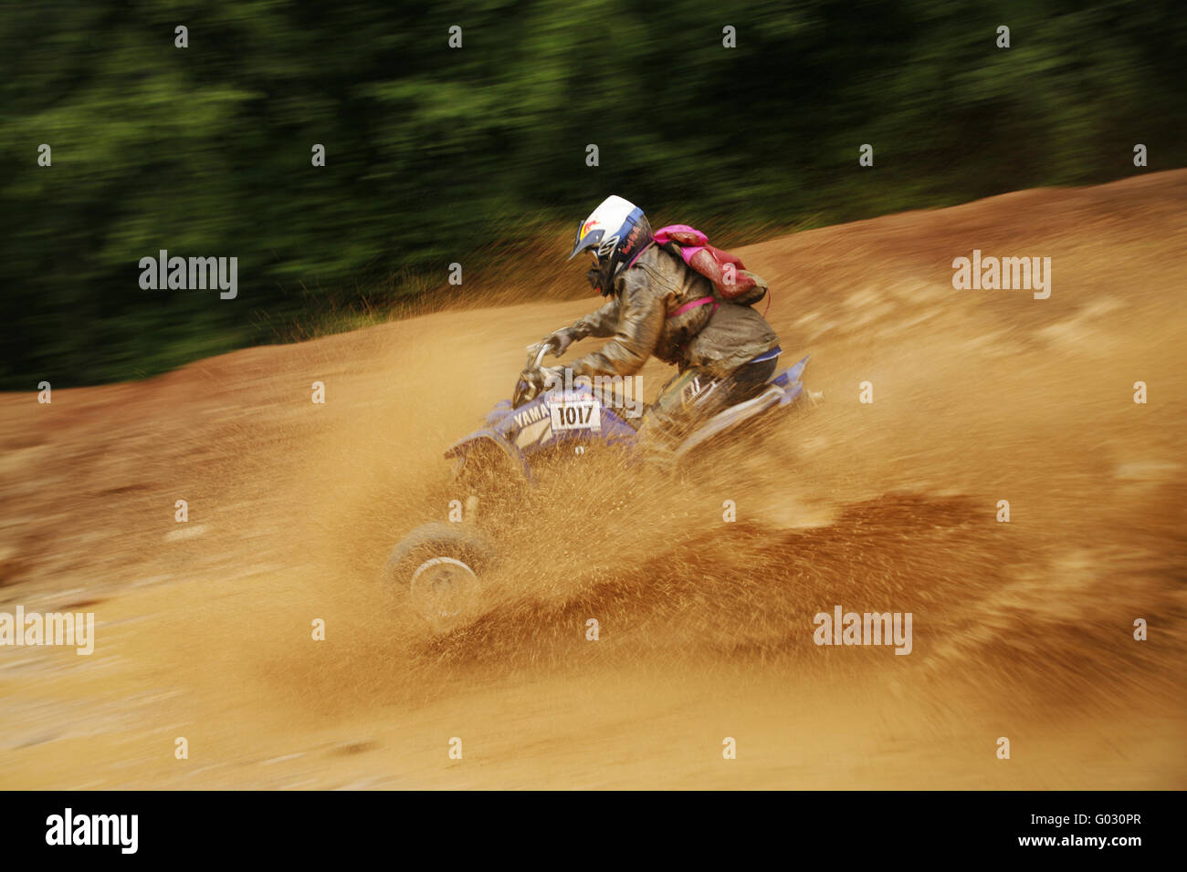 Quad driver in the dirt Stock Photo - Alamy