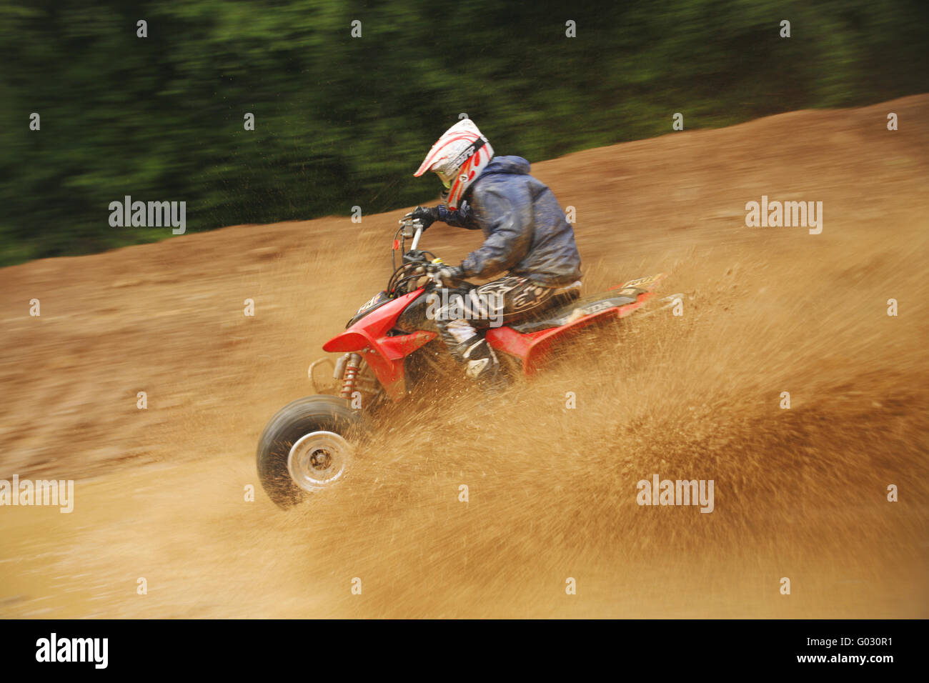 Quad driver in the dirt Stock Photo - Alamy