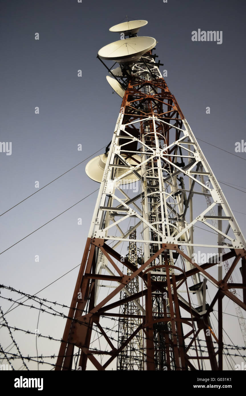 Antenna radio station tower on dark blue sky Stock Photo - Alamy