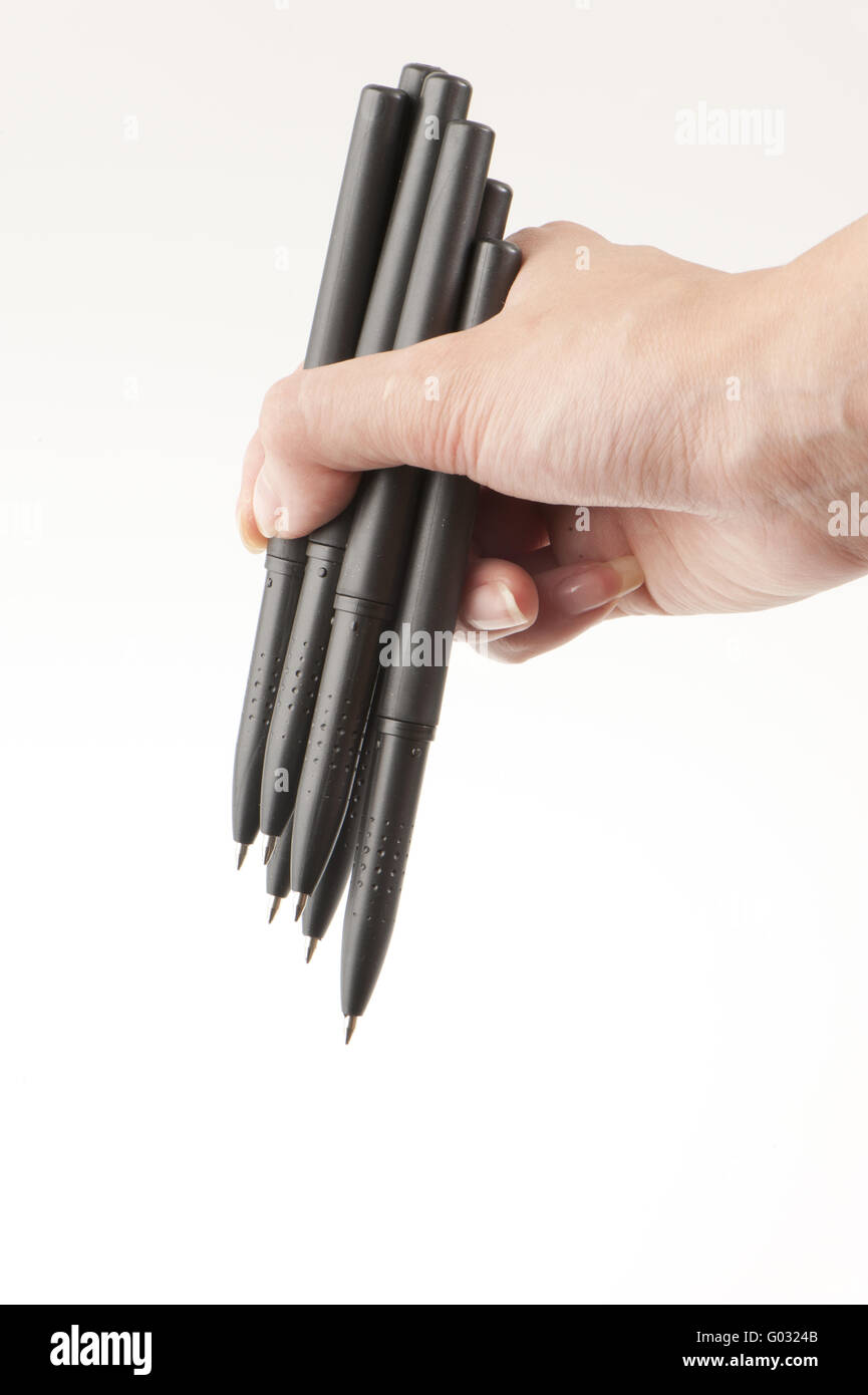 many black pens in hand Stock Photo - Alamy