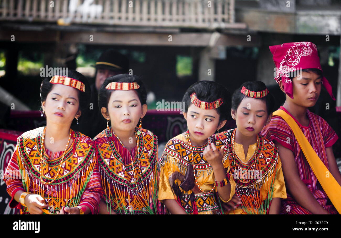 Children dressed with traditional toraja clothes during a funeral ...
