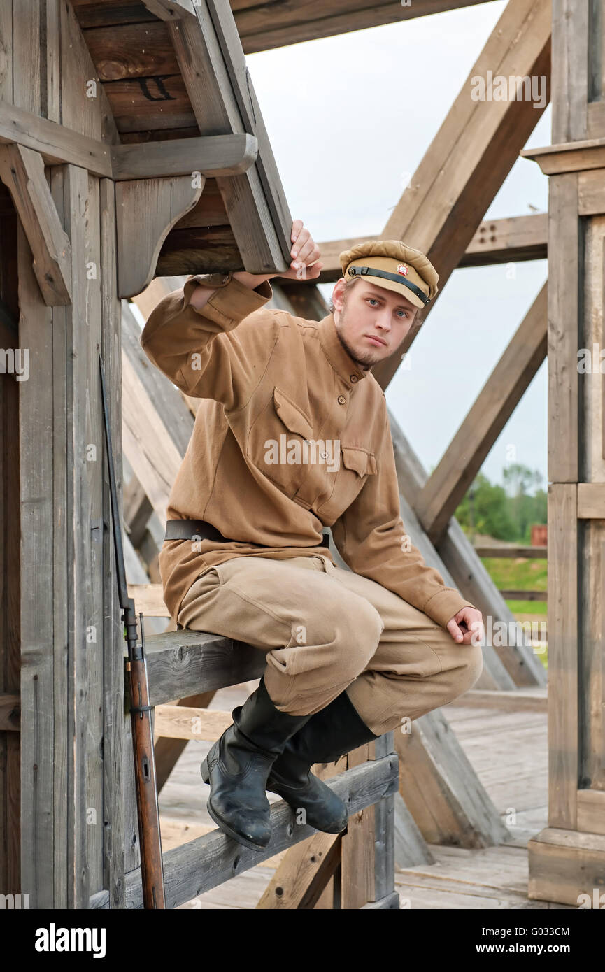 Retro style picture with soldier sitting next to the sentry Stock Photo ...