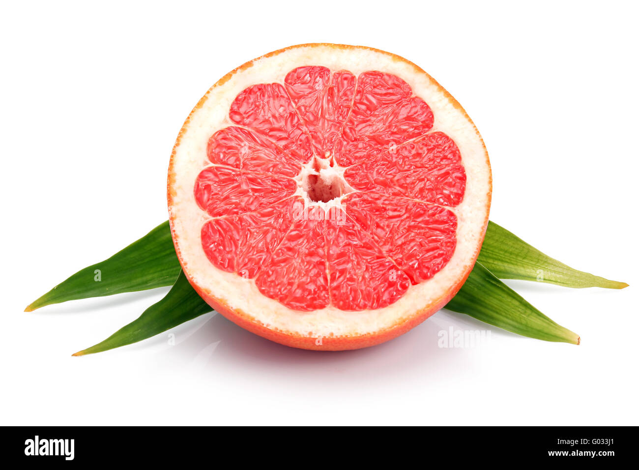 Sliced grapefruit fruit with green leaf isolated Stock Photo - Alamy