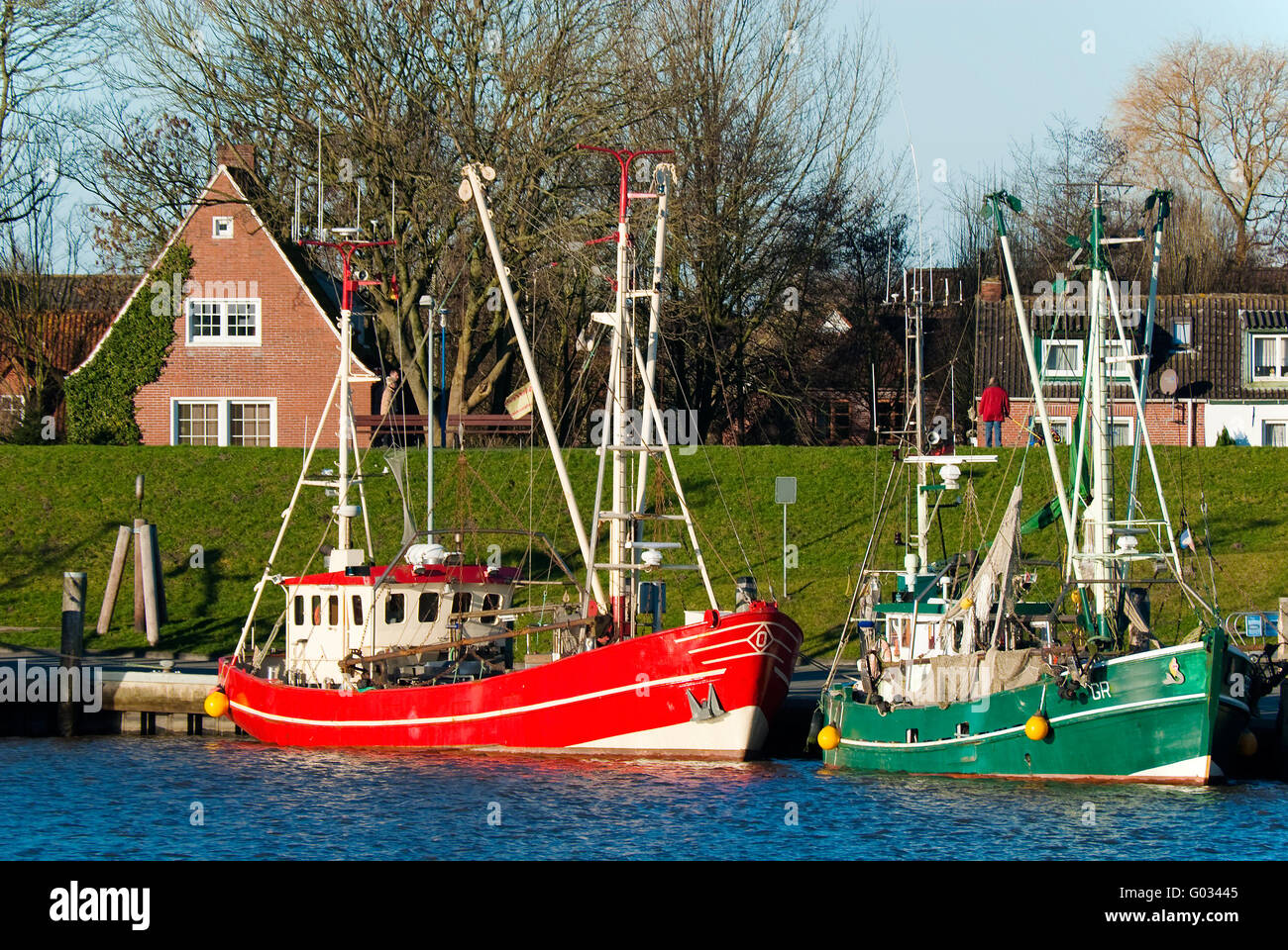 red and green fishing boats in the harbor Greetsie Stock Photo - Alamy