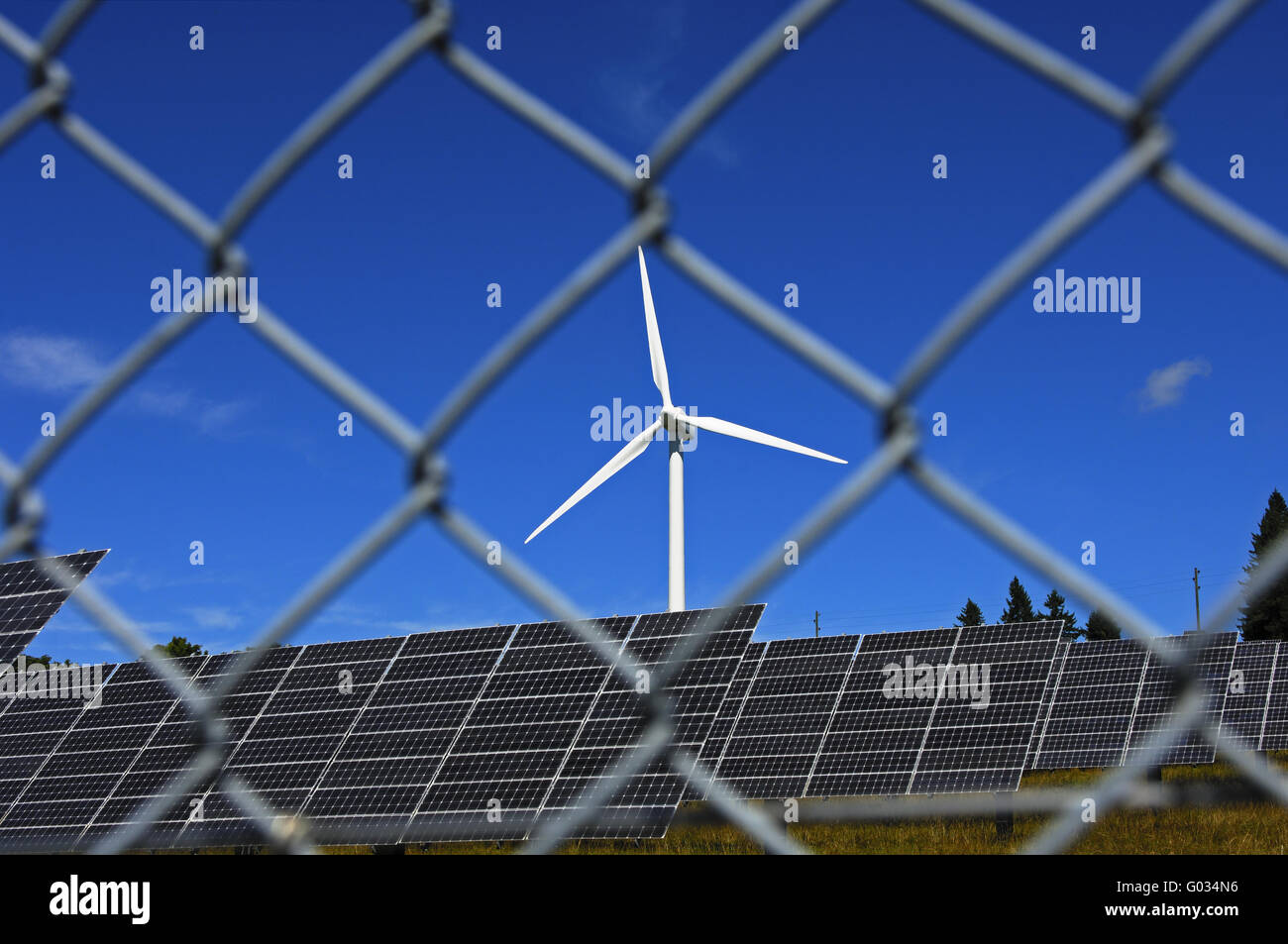 Energy security, solar panels and a wind turbine Stock Photo - Alamy