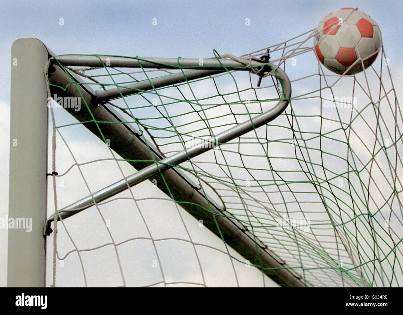 Football in the goal Stock Photo - Alamy