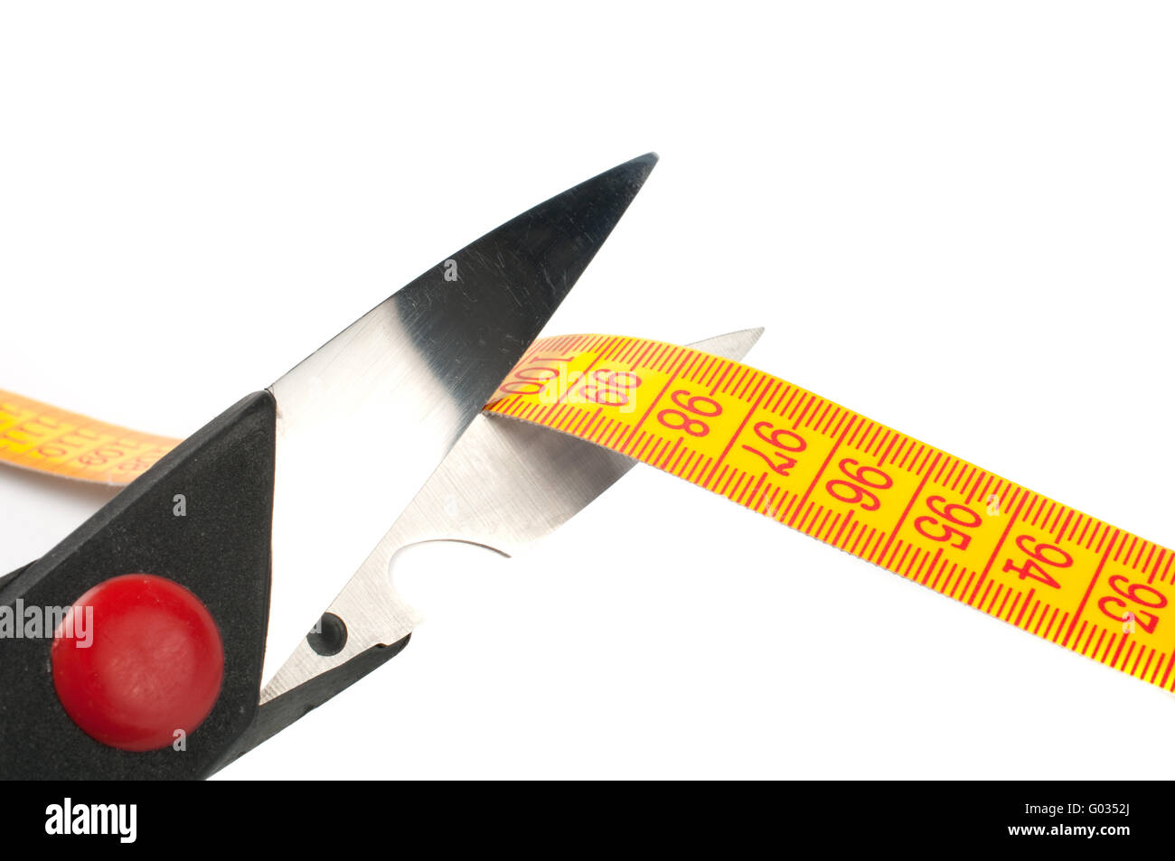 scissors cutting a measuring on white background Stock Photo - Alamy