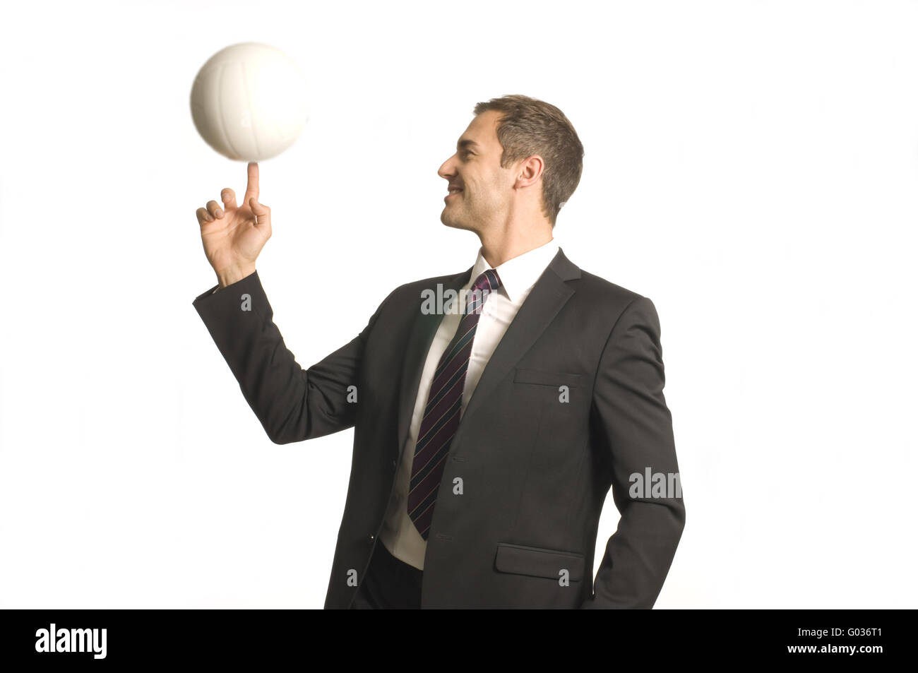 businessman playing with a ball Stock Photo - Alamy