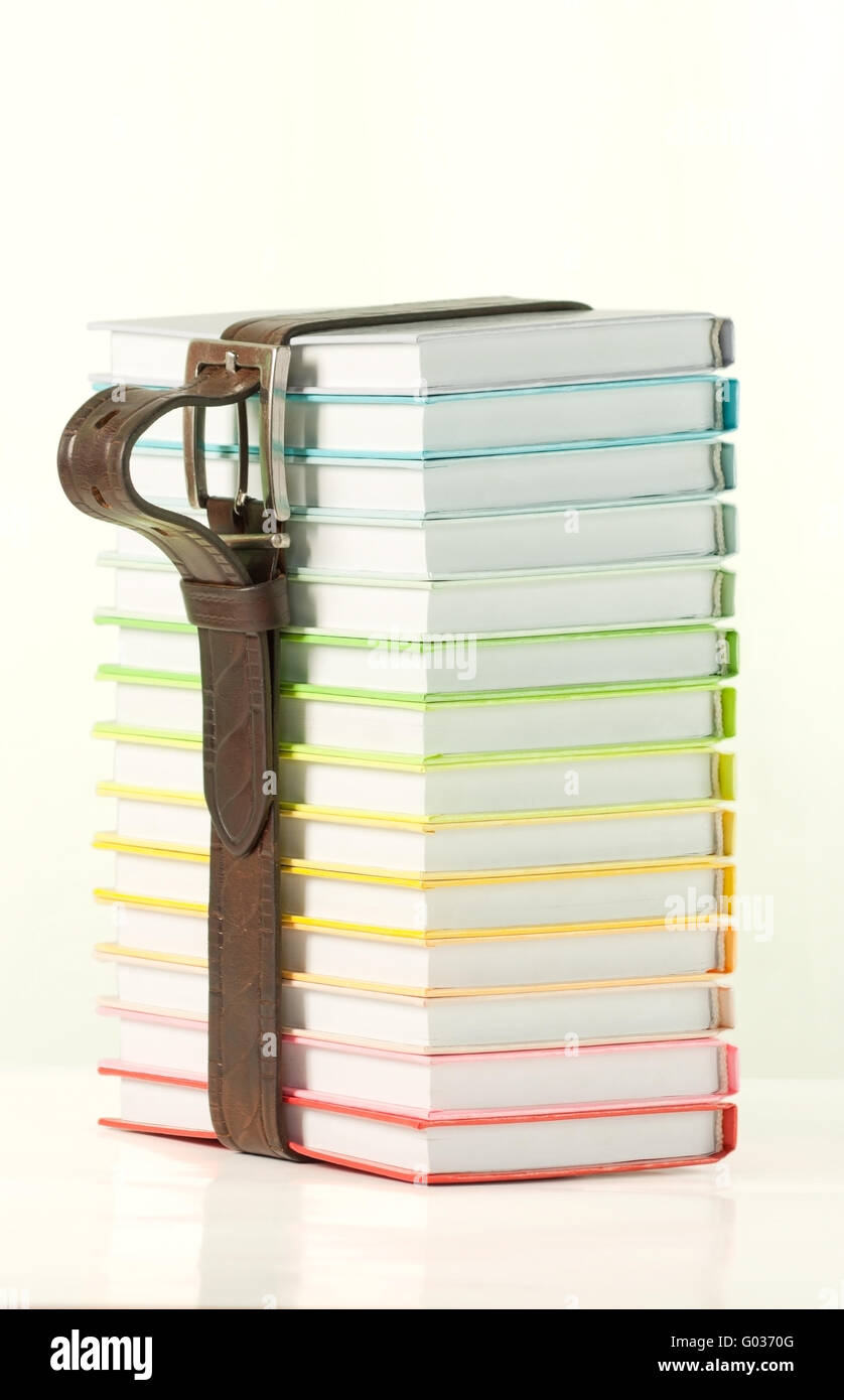 Stack of colorful books on the white background Stock Photo - Alamy