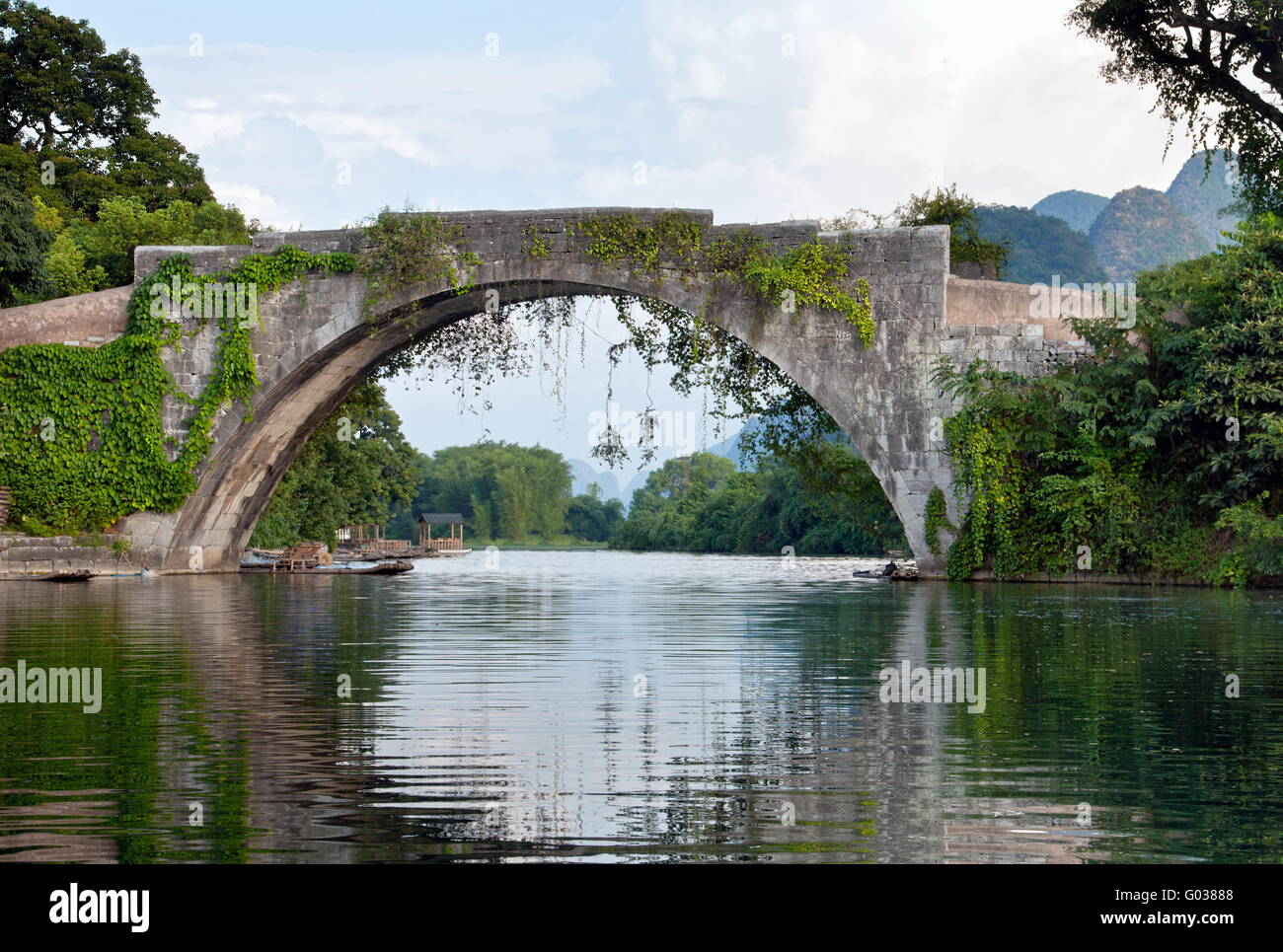 Chinese stone bridge landscape on li river with bridge reflection on ...