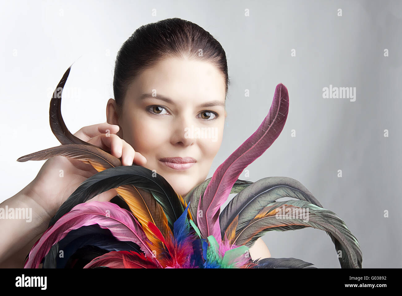 Girl with fether Stock Photo - Alamy