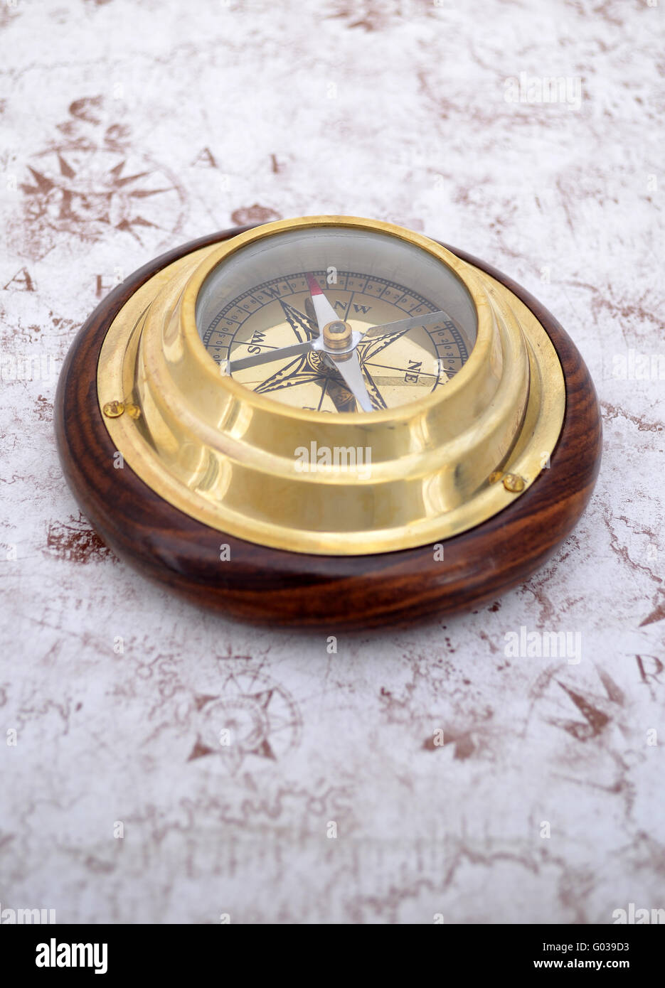 Compass on old paper Stock Photo - Alamy