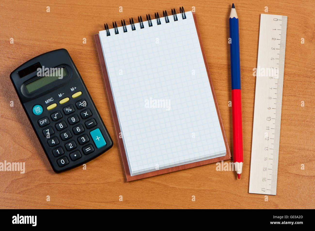 Notepad, calculator, and pencil on the table Stock Photo - Alamy