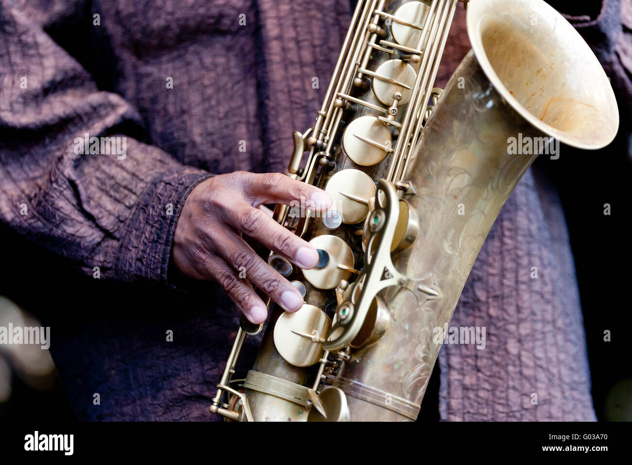 Hand and Saxophone of a musician Stock Photo - Alamy