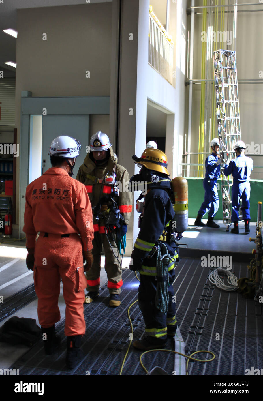 Firefighters with ladder and modern equipment Stock Photo - Alamy