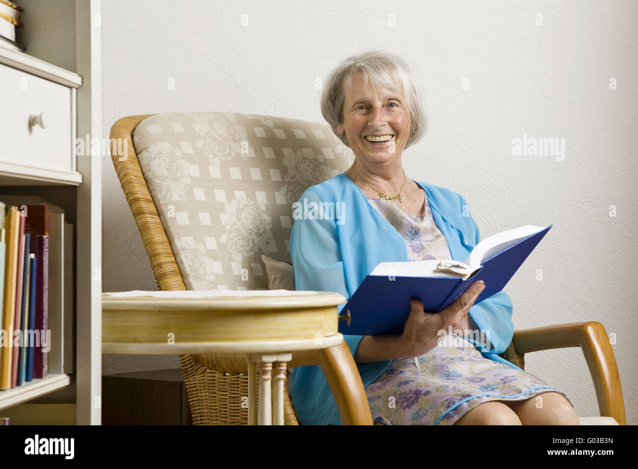 Senior woman reading a book Stock Photo - Alamy