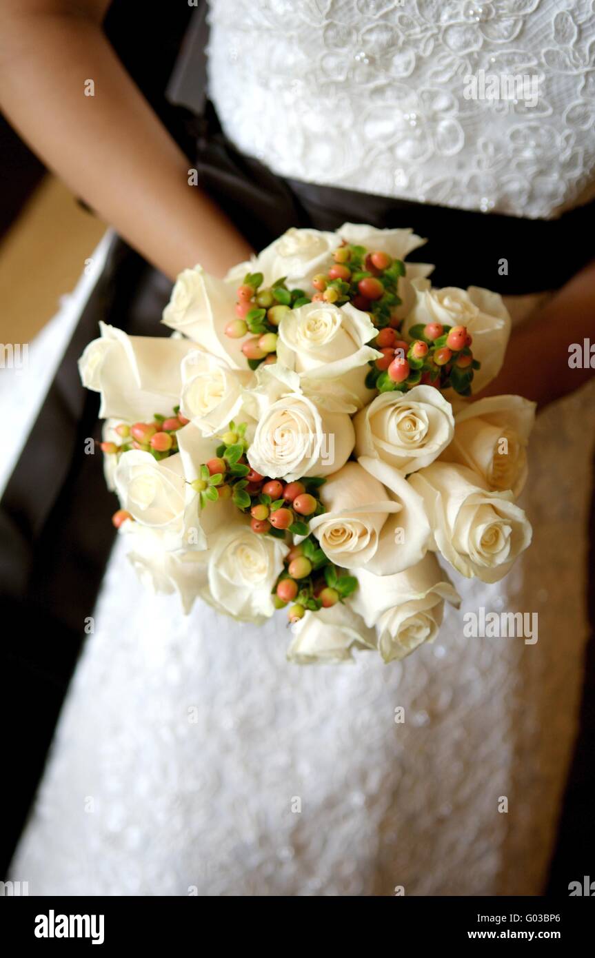 bride holding her beautiful bouquet Stock Photo - Alamy