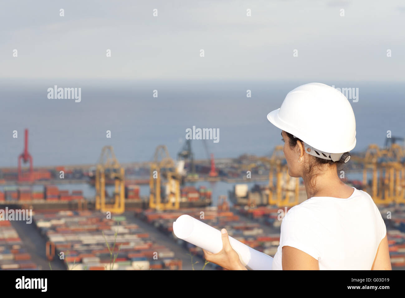 Engineer looks at port Stock Photo - Alamy