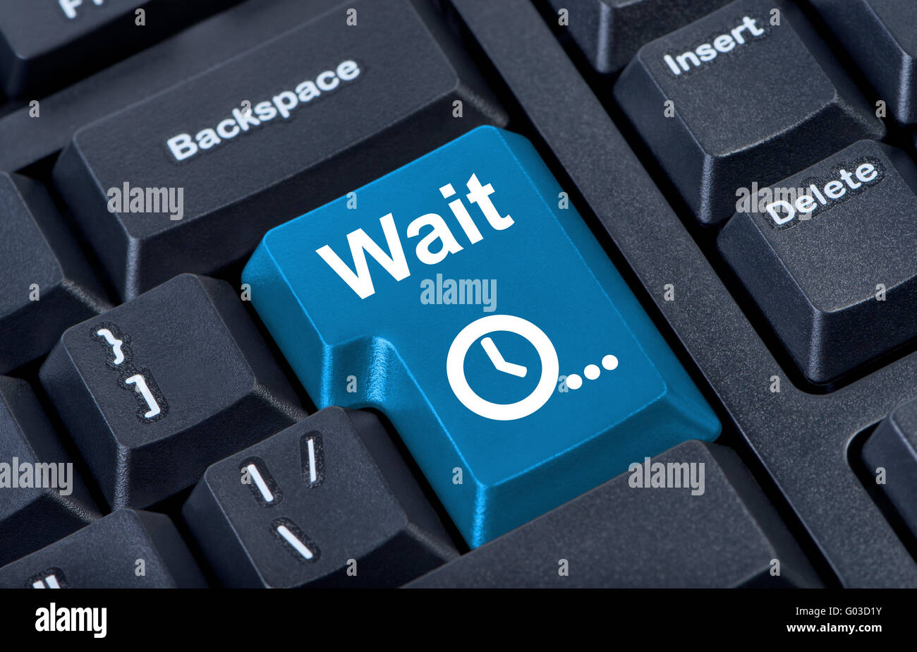 Button wait computer keyboard with clock icon Stock Photo - Alamy