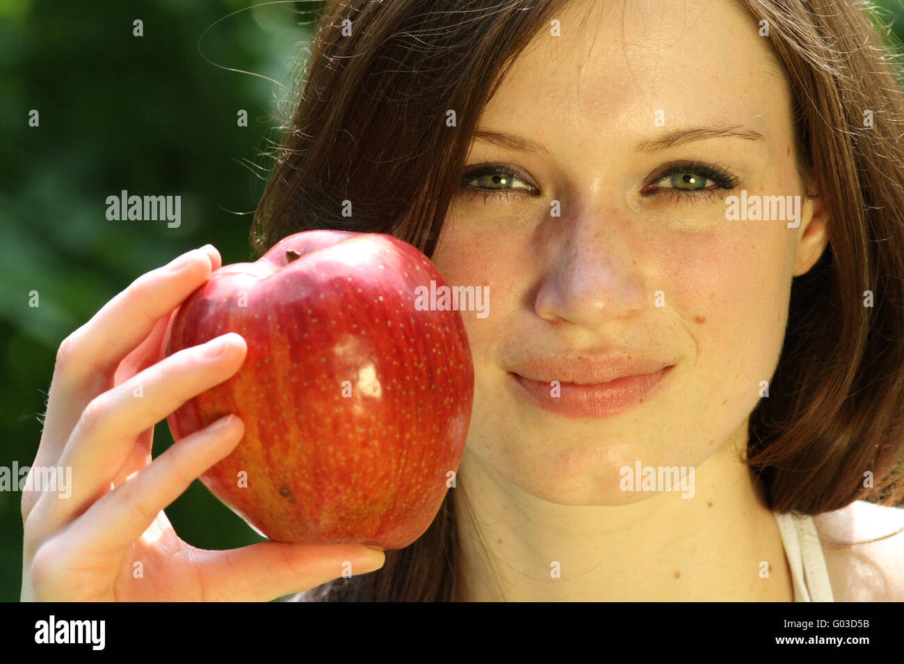 Woman with apple Stock Photo - Alamy
