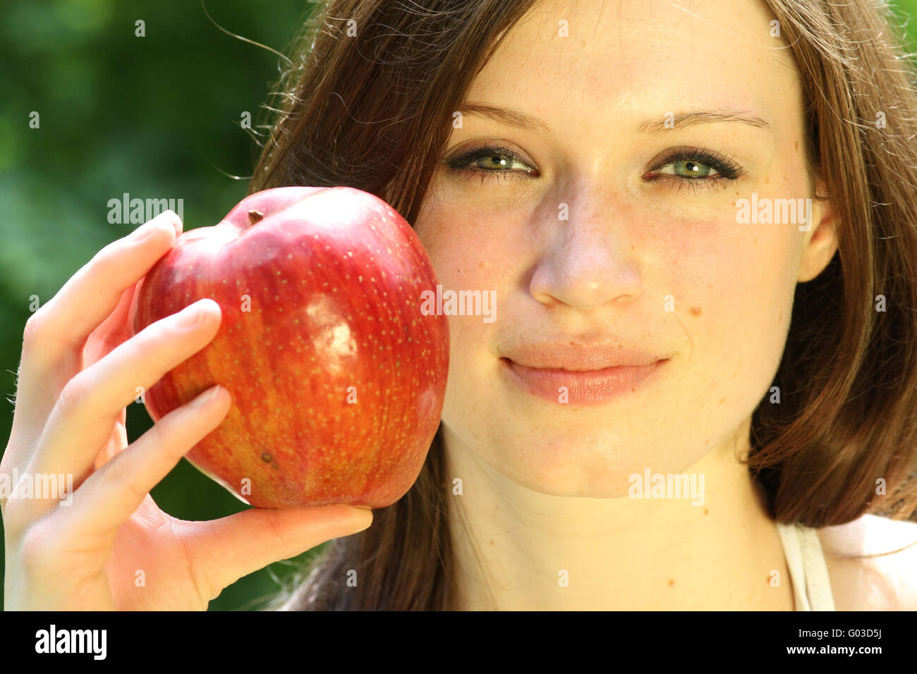 Woman with apple Stock Photo - Alamy