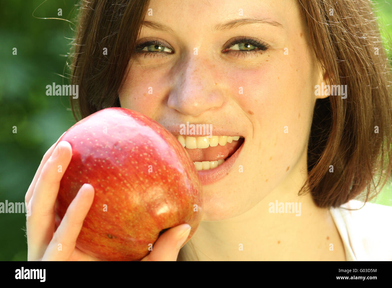 Woman with apple Stock Photo - Alamy